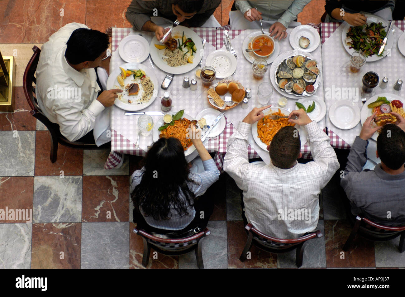 Office workers eat lunch Stock Photo - Alamy