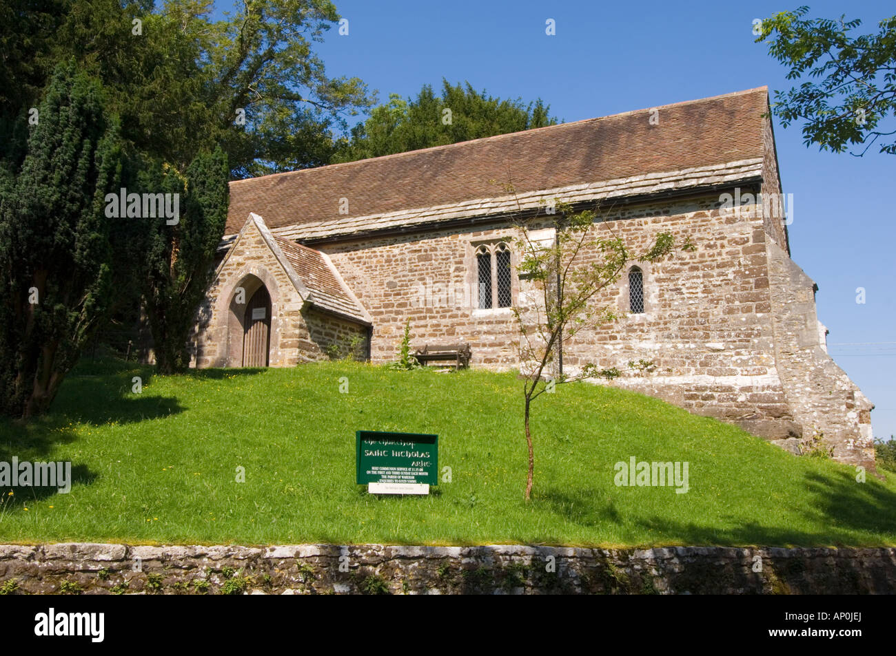 Arne village church Stock Photo - Alamy