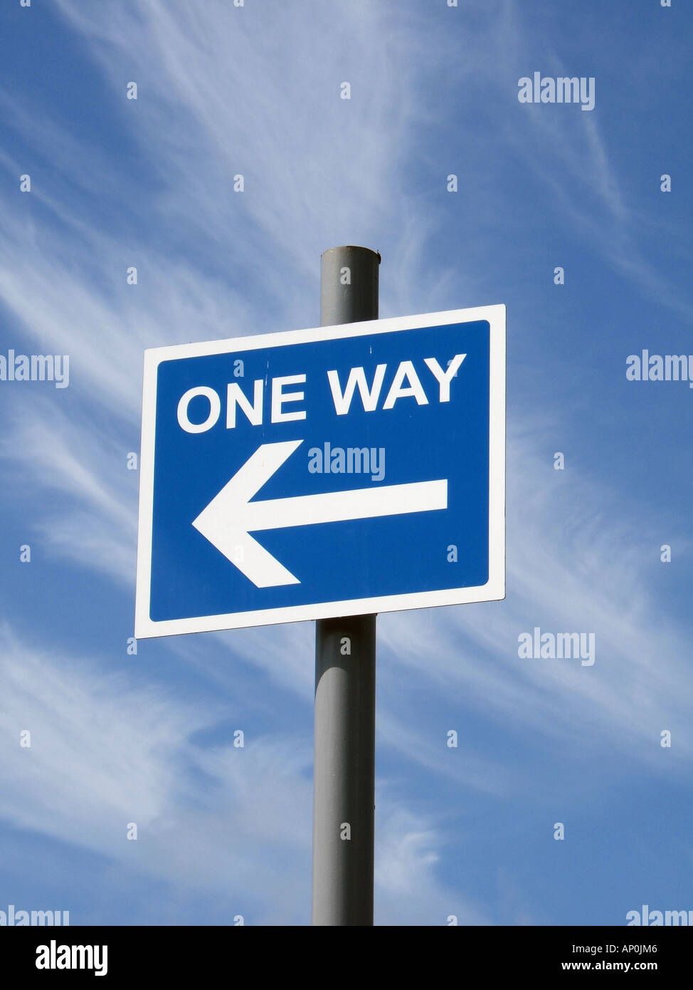 one way traffic road sign and blue sky Stock Photo - Alamy