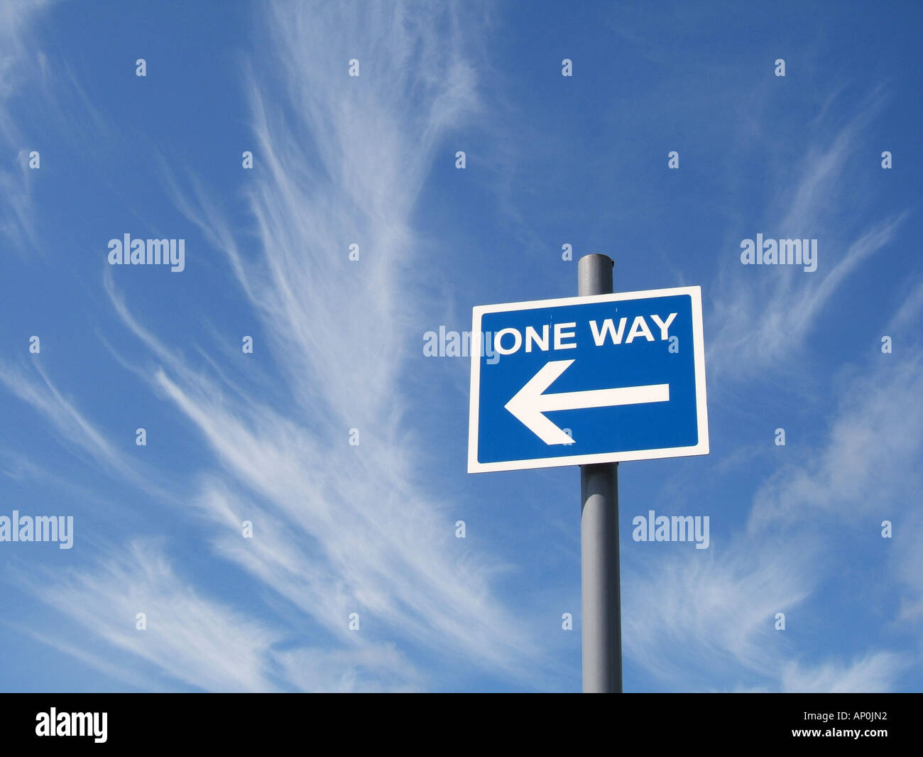 one way traffic road sign and blue sky Stock Photo - Alamy