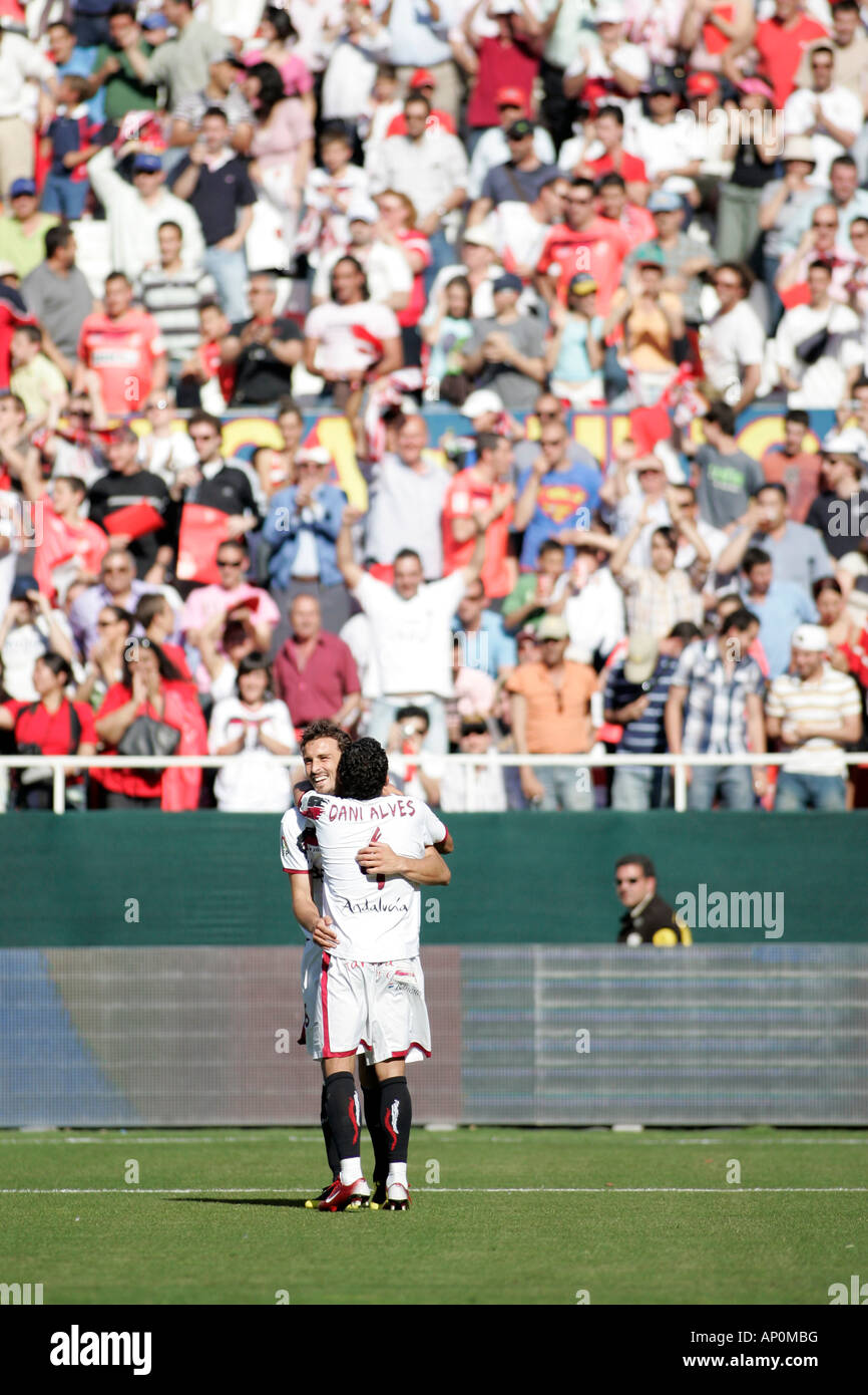 Sevilla FC players hugging to celebrate a Puerta's goal Stock Photo - Alamy