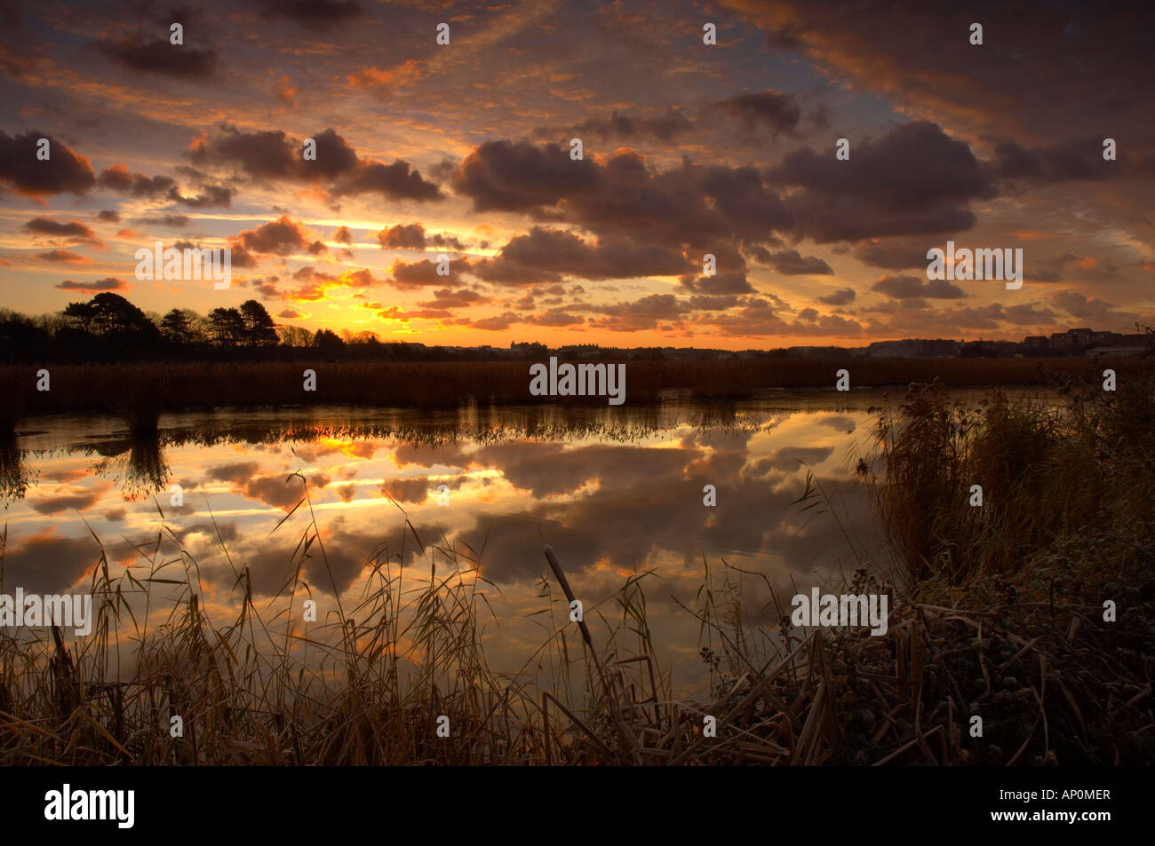 Colourful dawn sunrise over Radipole nature reserve in Weymouth Dorset ...