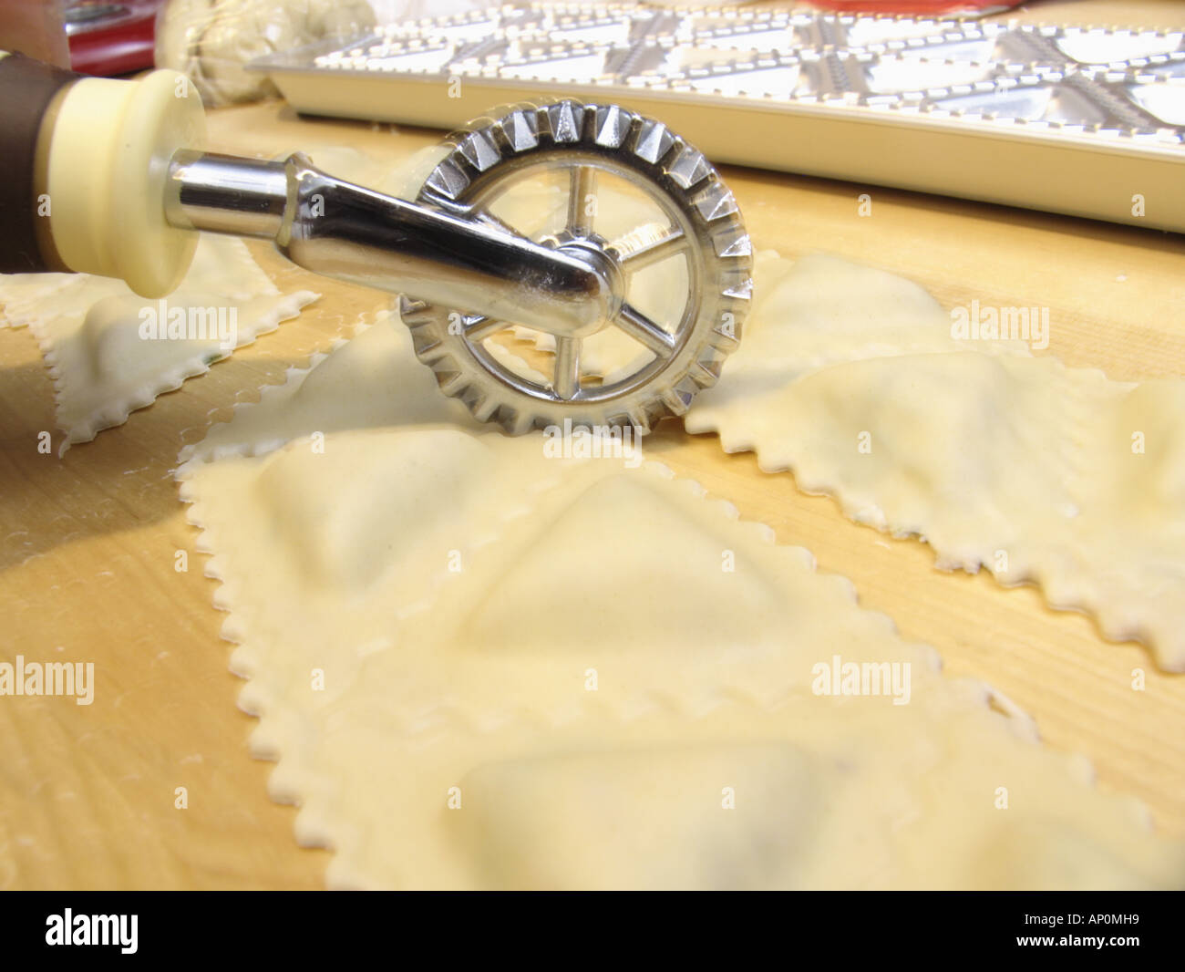 mold formed ravioli showing the mold and cutter Stock Photo - Alamy
