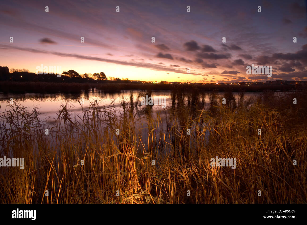 Colourful sunrise over Radipole nature reserve in Weymouth Dorset UK ...