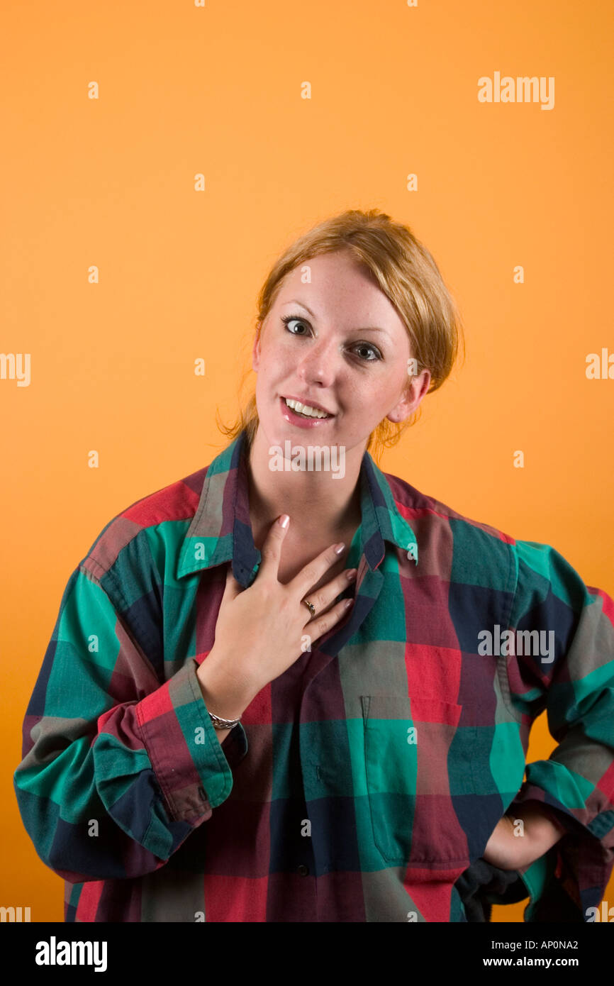 Young blond woman with her hand resting on her chest Model Released ...