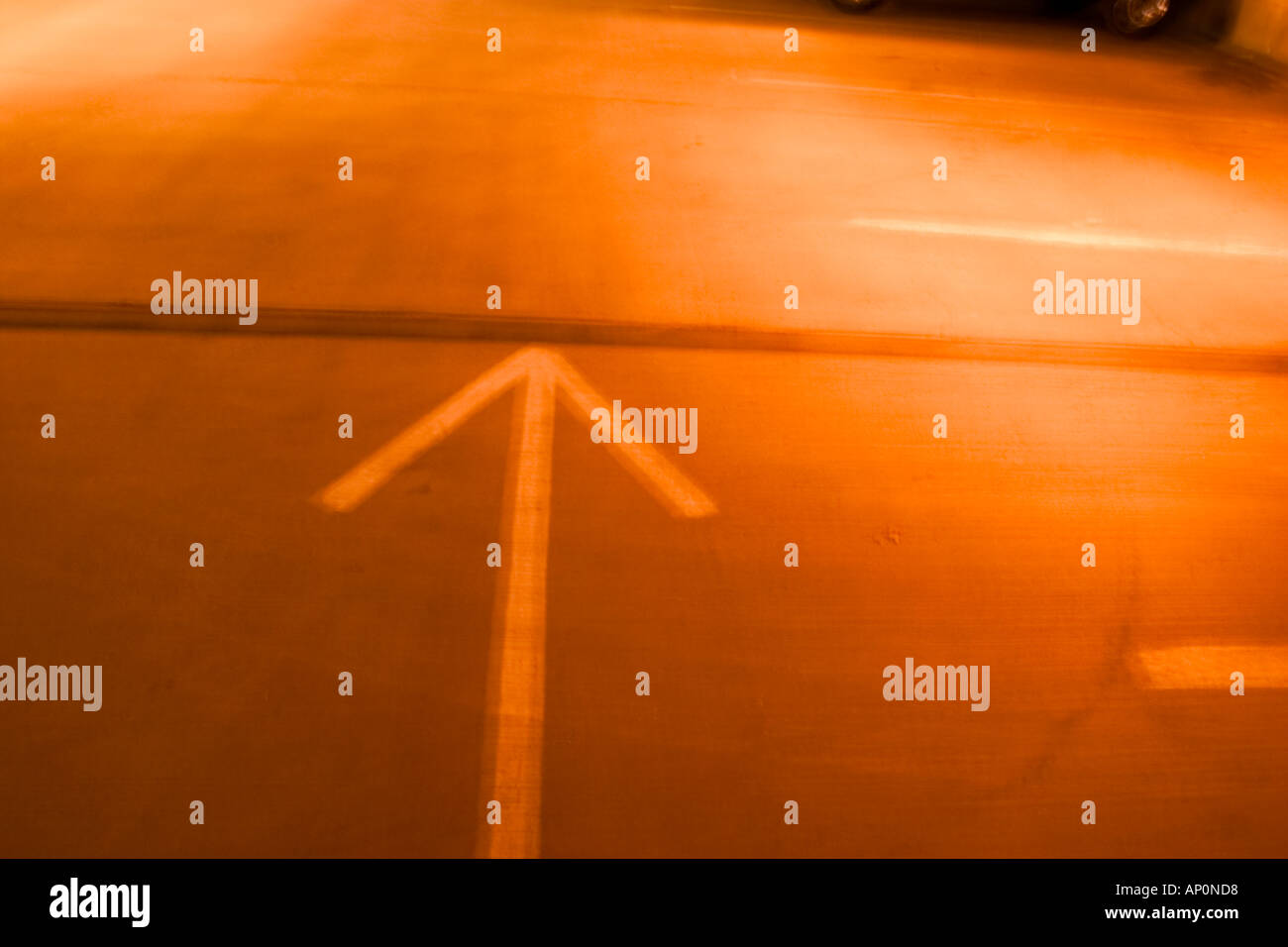 Traffic direction arrow painted on the floor of a parking garage Stock ...