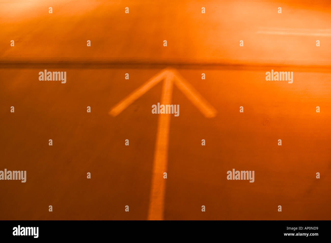 Traffic direction arrow painted on the floor of a parking garage Stock ...