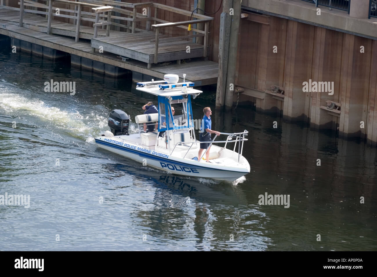 Police in a boat patrolling a river Stock Photo - Alamy