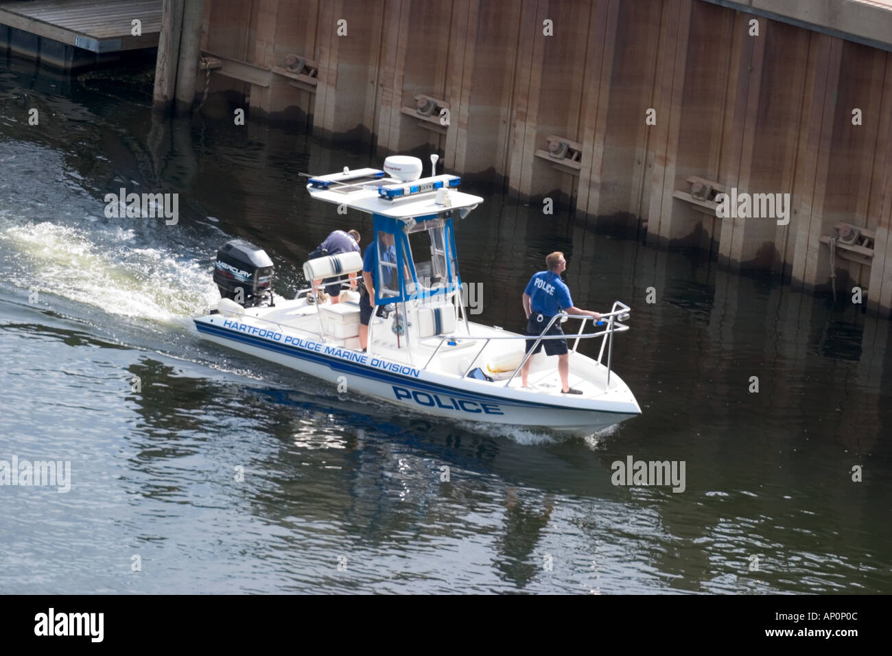 Police in a boat patrolling a river Stock Photo - Alamy