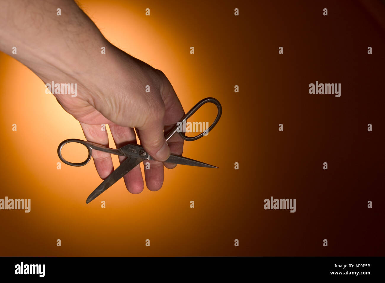 Hand holding pair scissors hi-res stock photography and images - Alamy