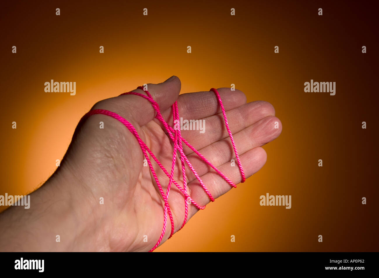 Man s hand tied up with red string Model Released Stock Photo - Alamy