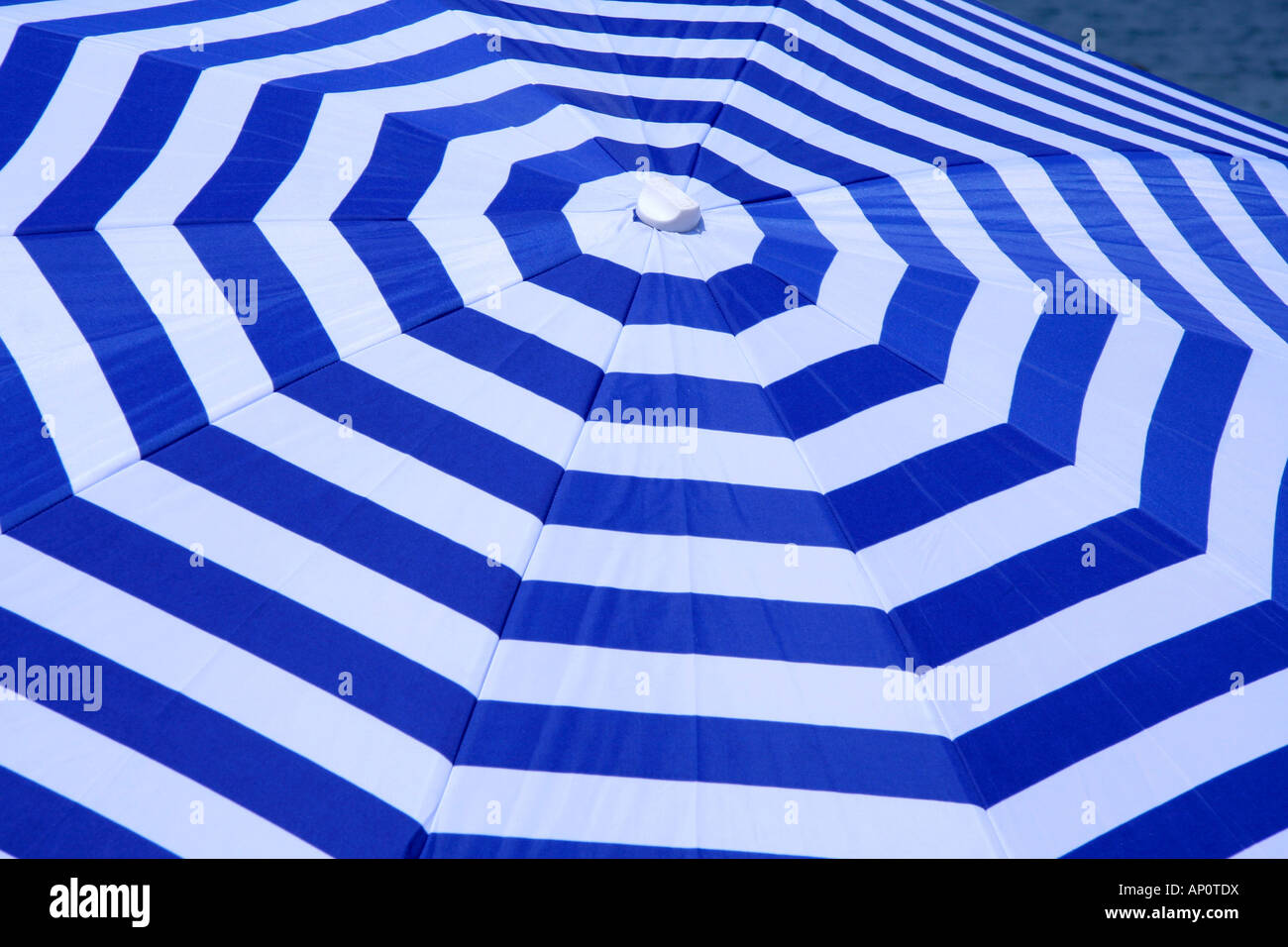 blue and white striped parasol on beach Stock Photo - Alamy