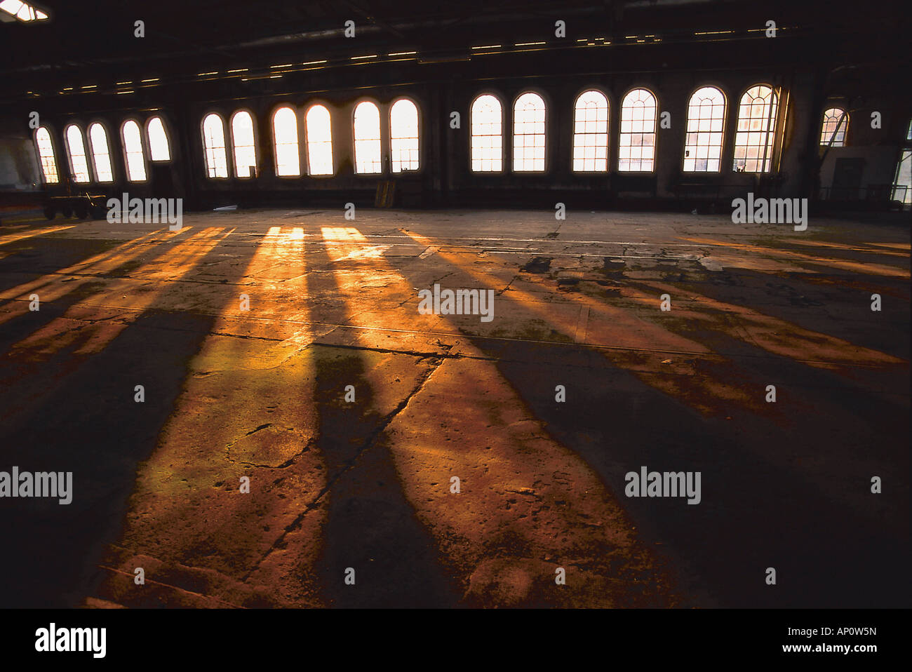 Sunlight falling into empty factory building Stock Photo - Alamy