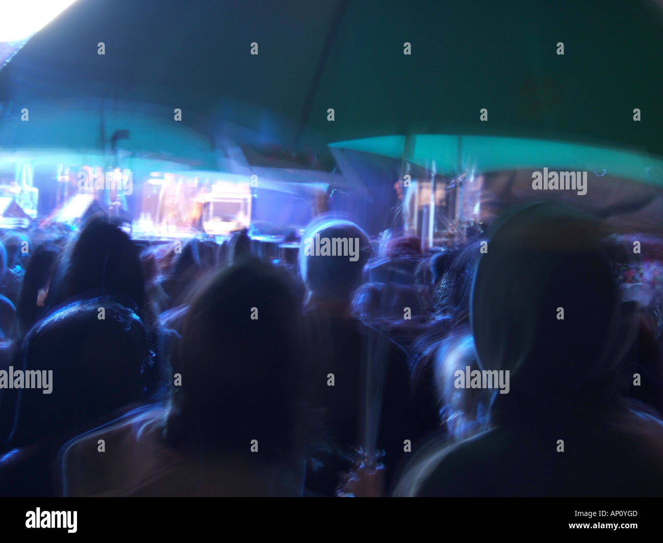 crowd in concert in pouring rain Stock Photo - Alamy