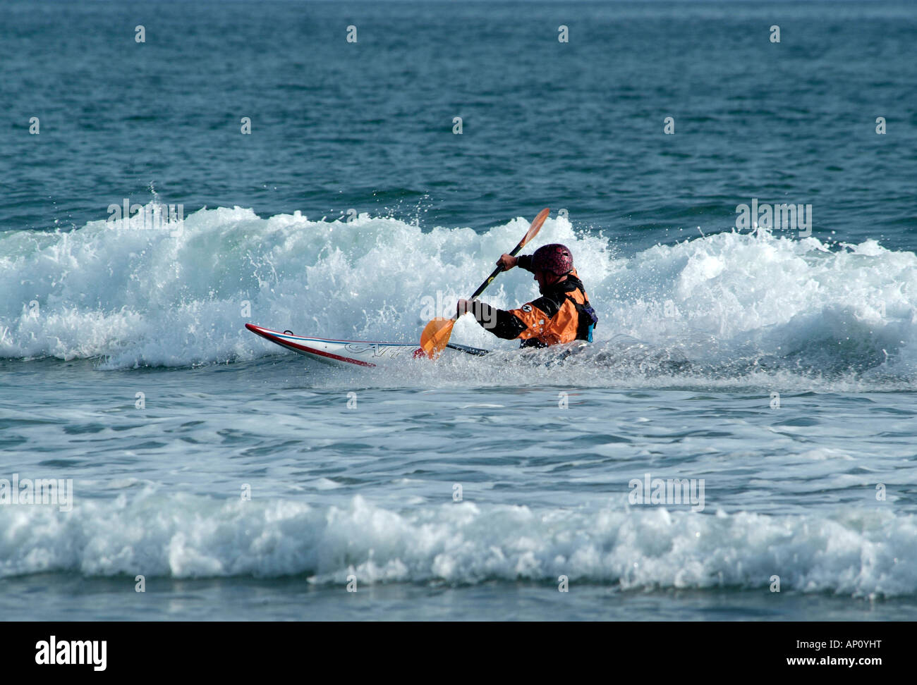 Canoe kayak kayaking surf surfing wave sport water sea Wales Welsh UK ...