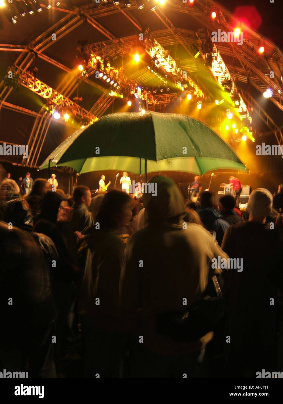 couple and crowd in concert in pouring rain Stock Photo - Alamy