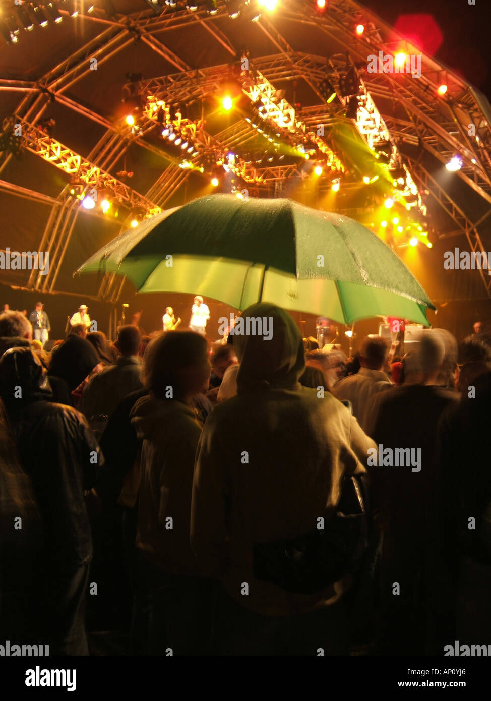couple and crowd in concert in pouring rain Stock Photo - Alamy