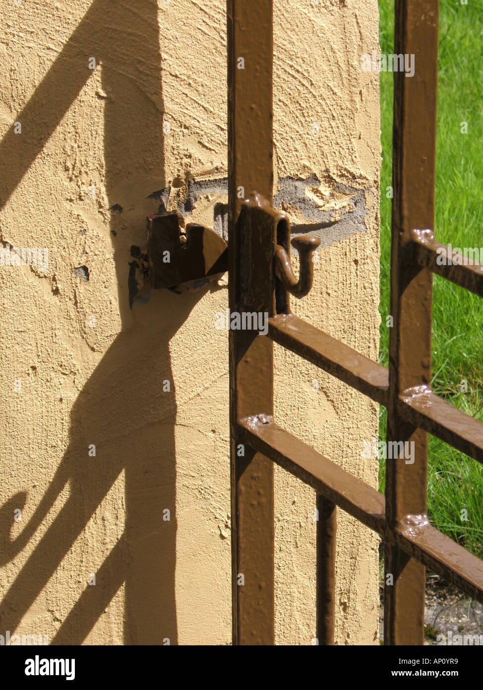 close up of brown metal garden gate Stock Photo - Alamy
