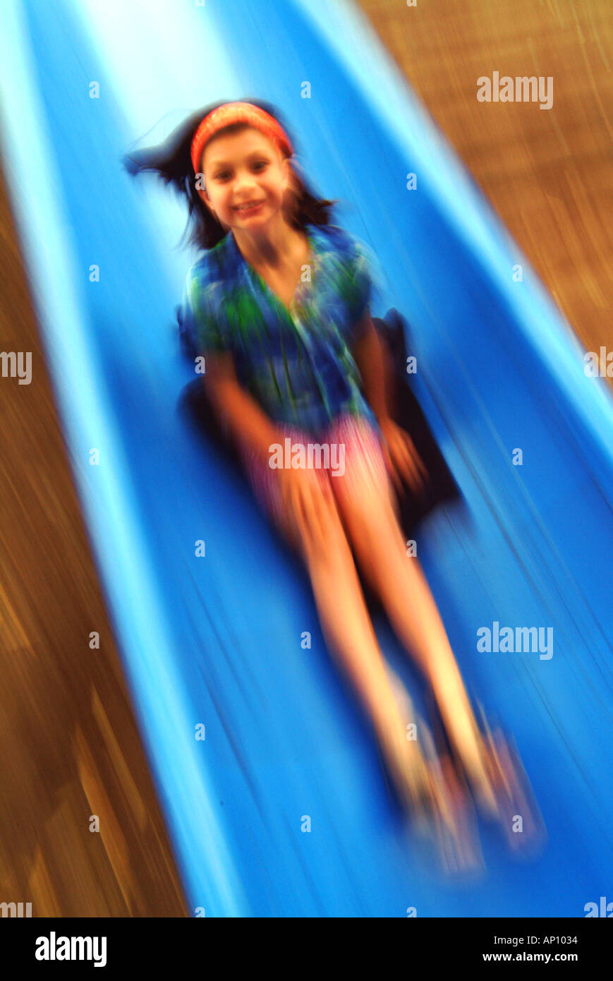 Young girl on slide Stock Photo - Alamy