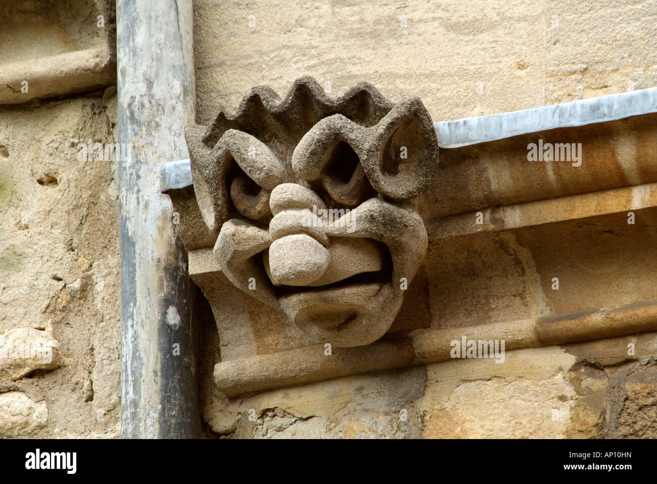head gargoyle close up Oxford university town stone carving distorted ...