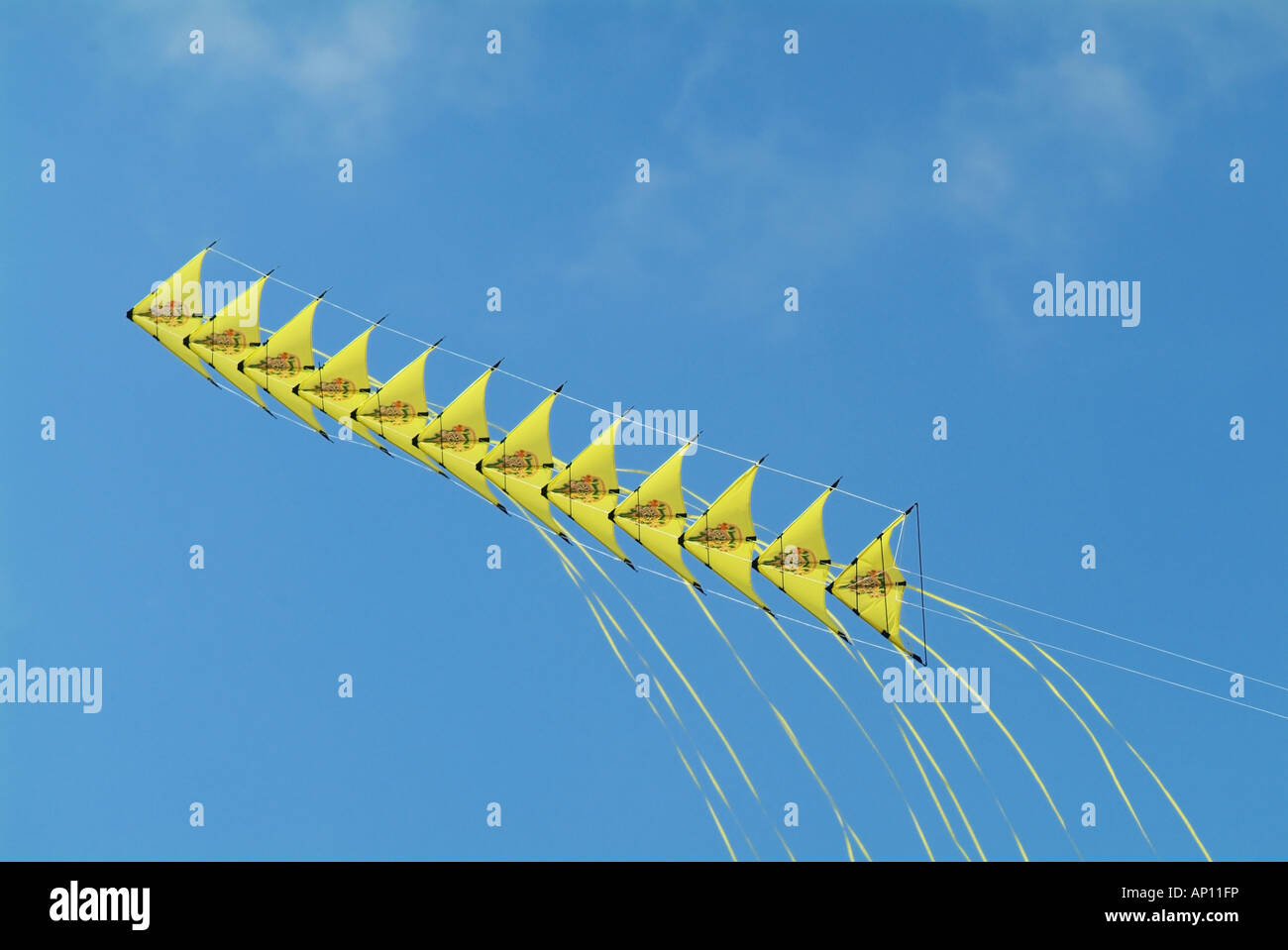 A string of yellow kites all with the monogram of King Bhumibol of ...