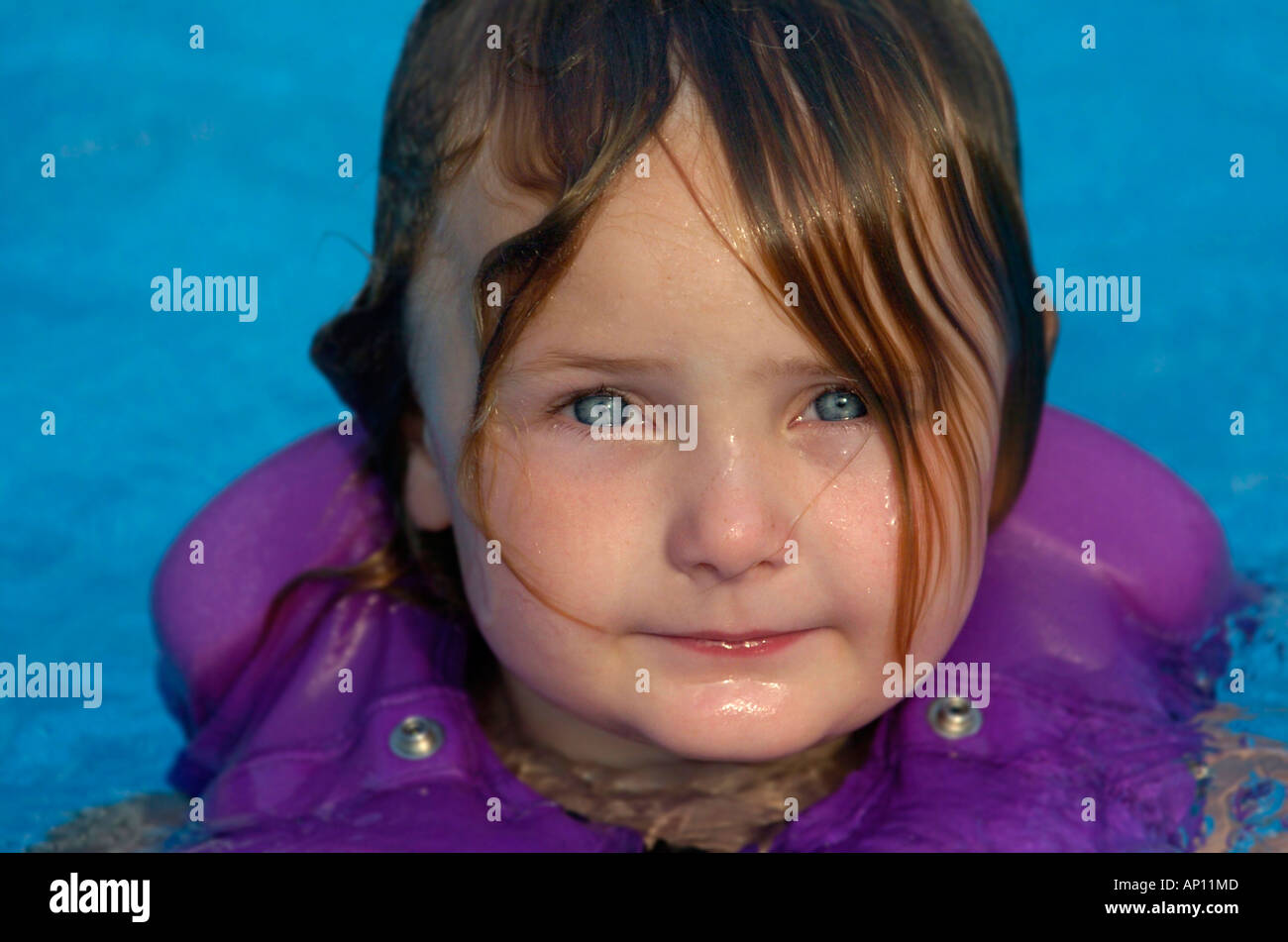 A young girl is all wet after leaving swimming pool Stock Photo - Alamy