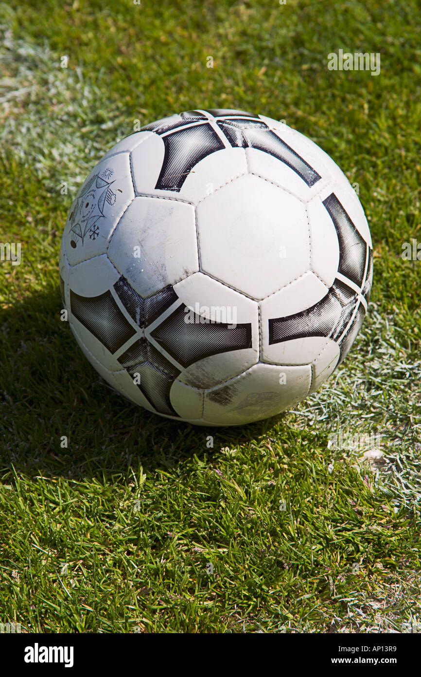 Soccer ball on soccer field Stock Photo - Alamy