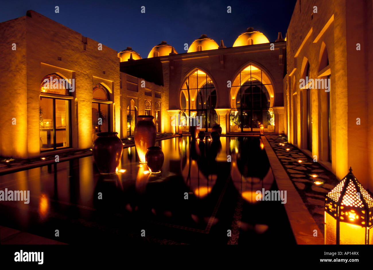 Illuminated atrium of the Royal Mirage Hotel at night, Dubai, United ...