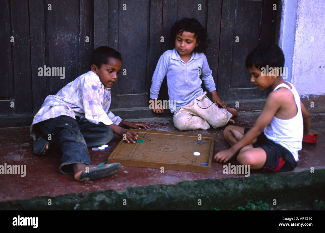 Nepalese children playing a game on a Kata board in Pokhara Nepal Stock ...