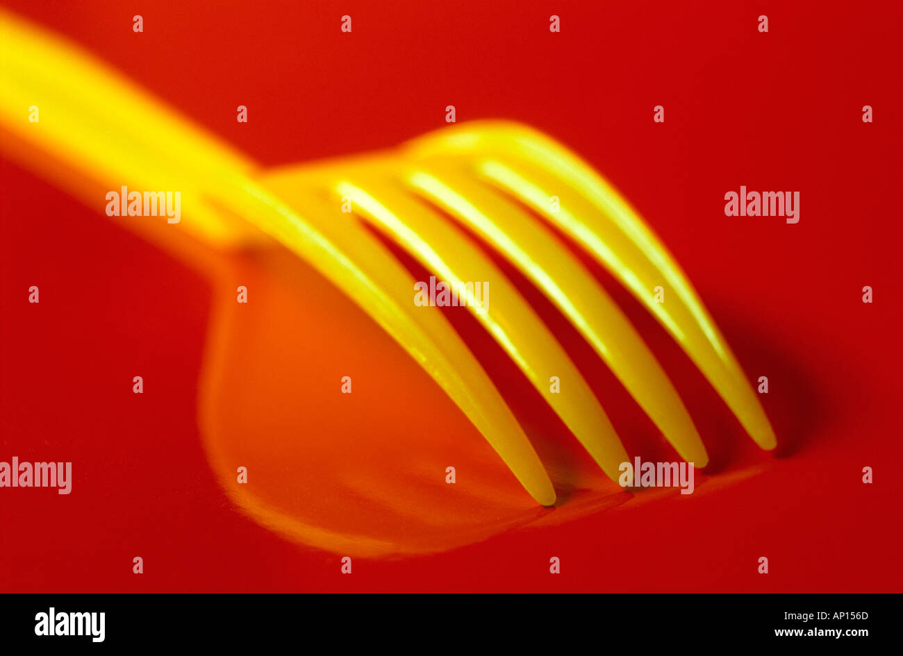focused plastic yellow fork Stock Photo - Alamy