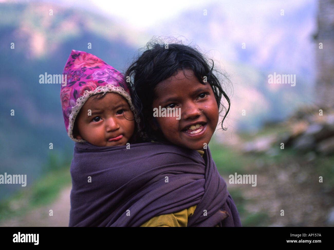 Young Nepalese girl and baby in the Annapurna region of Nepal Stock ...