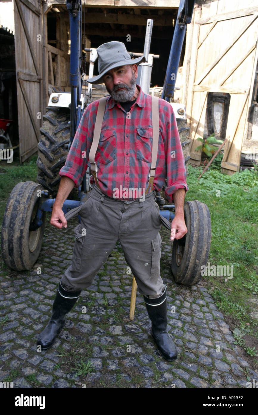 poor farmer showing his empty pockets Stock Photo - Alamy
