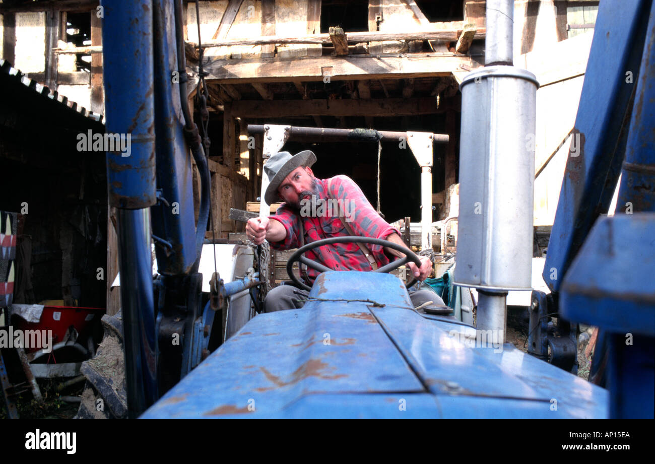 funny farmer driving his tractor Stock Photo - Alamy