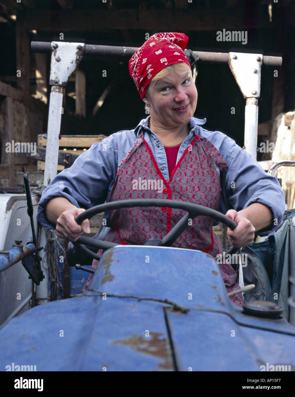 Woman farmer driving old tractor hi-res stock photography and images ...