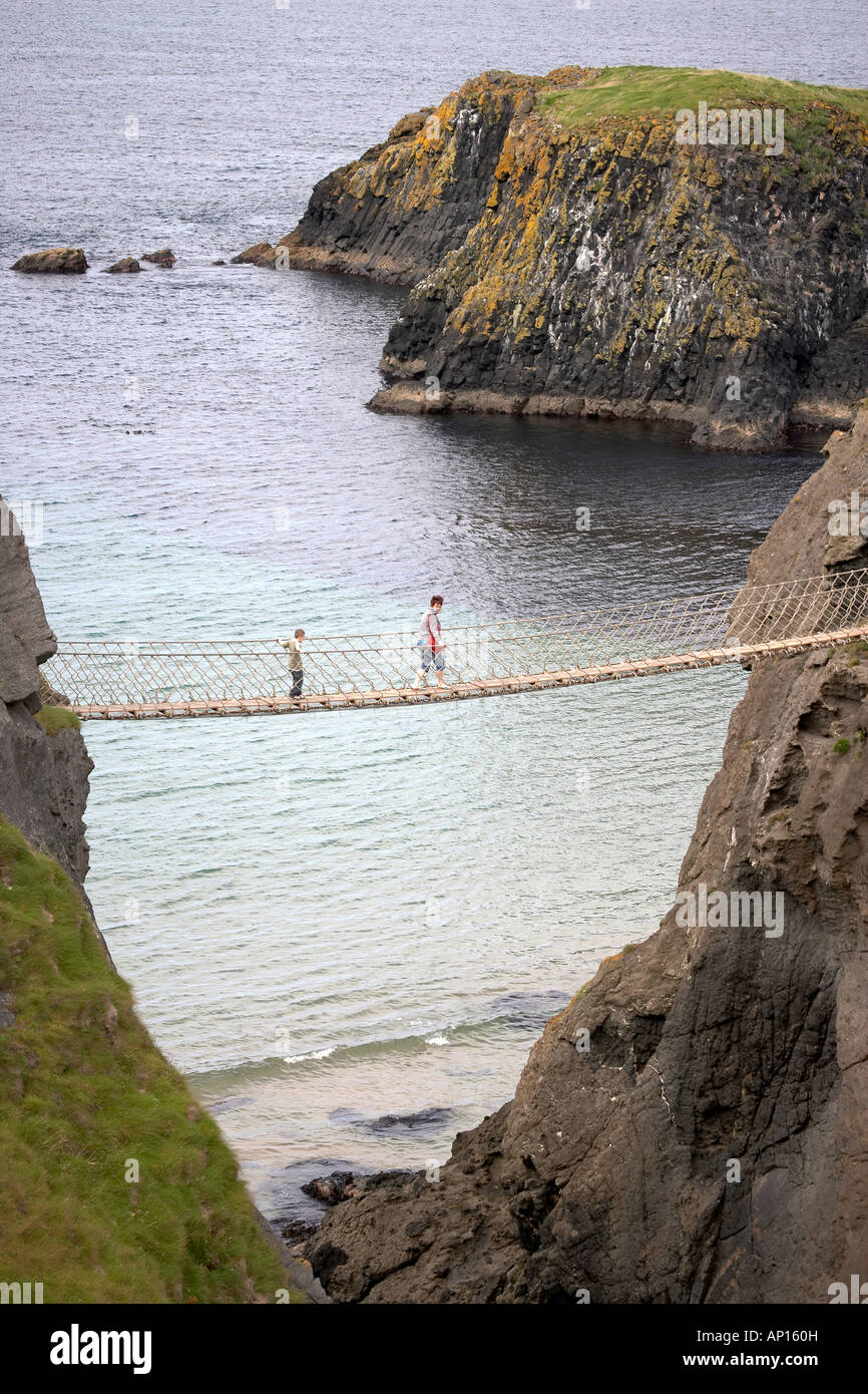 People crossing the Carrick a Rede rop bridge Co Antrim Northern ...
