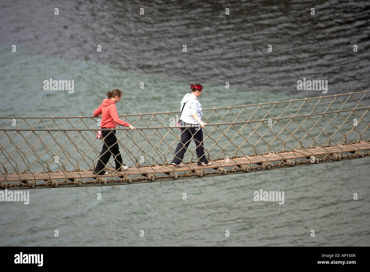 People crossing the Carrick a Rede rop bridge Co Antrim Northern ...