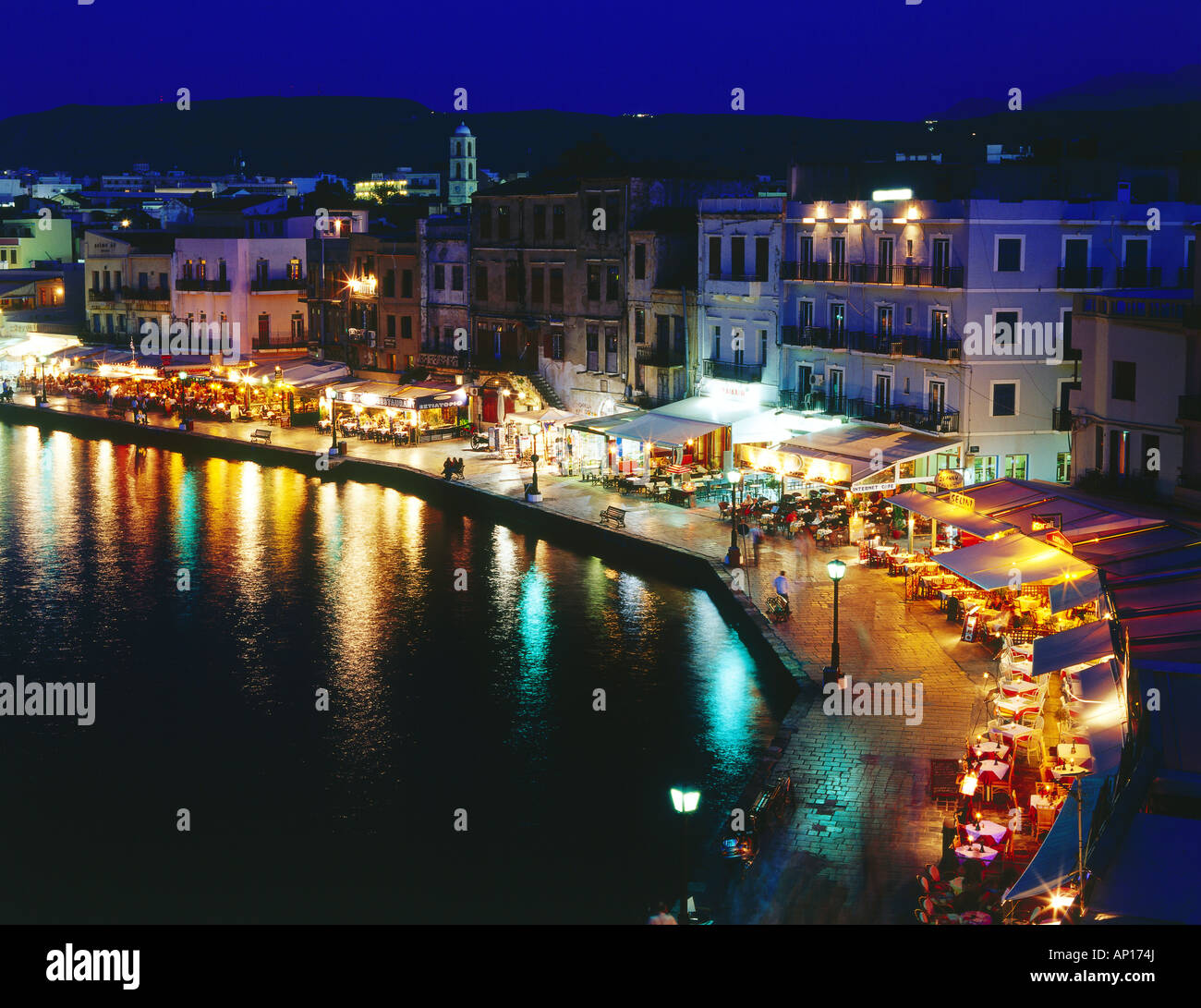 Illuminated Venetian Harbour at night with restaurants, Chania, Crete ...
