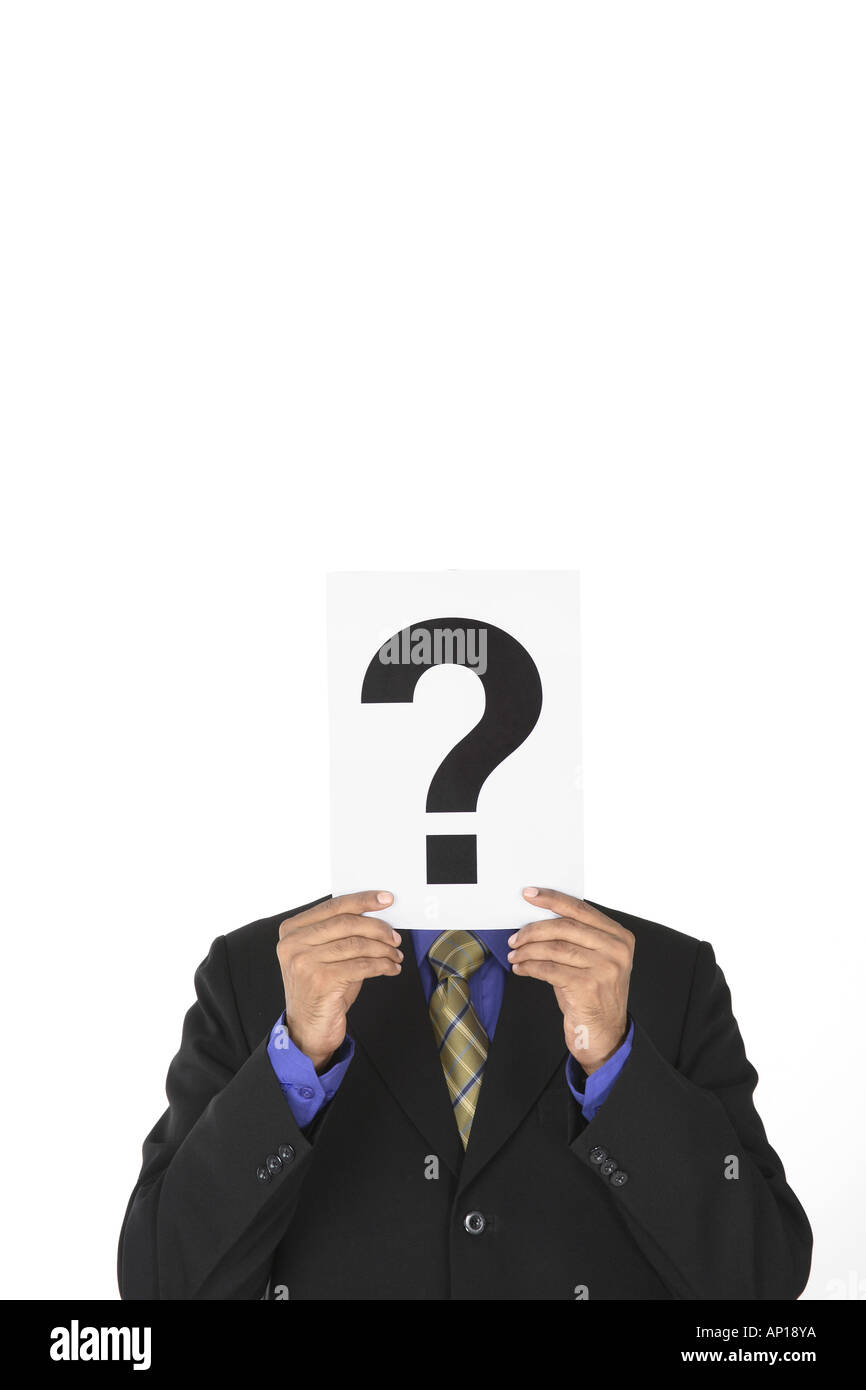 Question mark, executive holding paper with the question mark in front ...