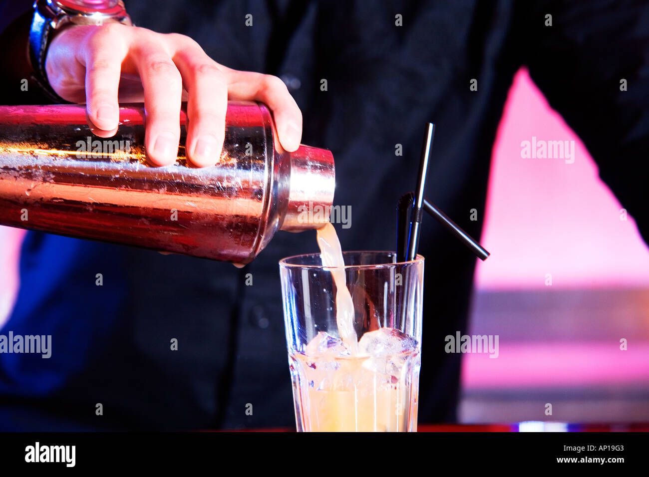 Bartender pouring drink out of shaker, (close-up Stock Photo - Alamy