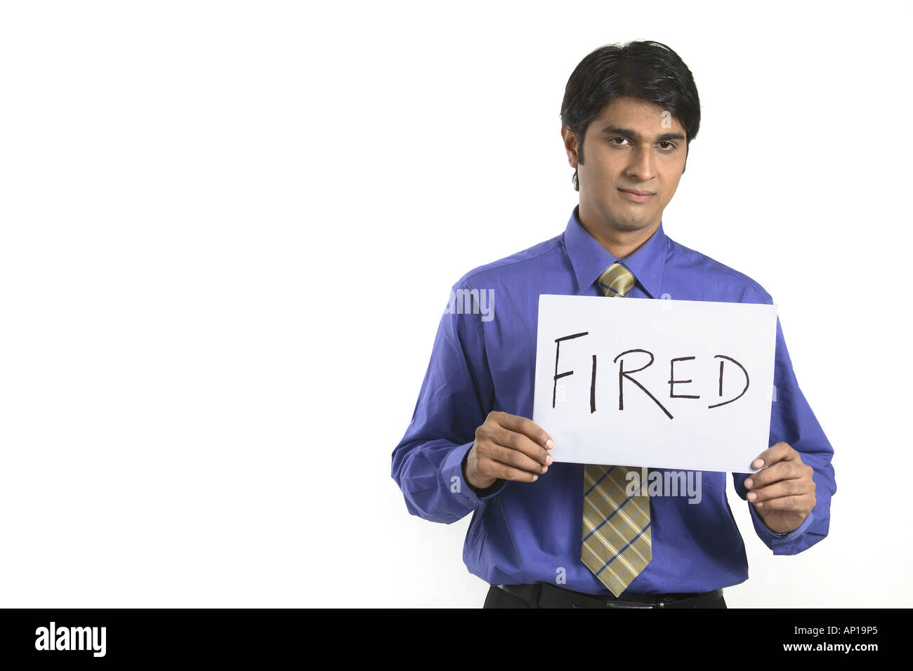 Fired young businessman holding Cut Out Stock Images & Pictures - Alamy