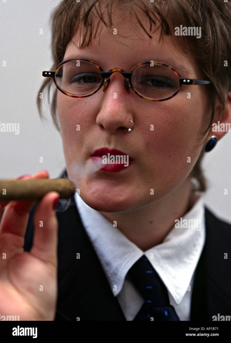 young woman smoking a cigar MR Model Released Stock Photo - Alamy