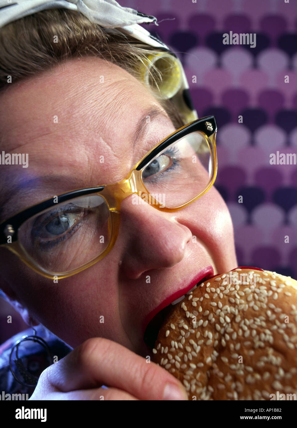 Woman biting big fast food hi-res stock photography and images - Alamy