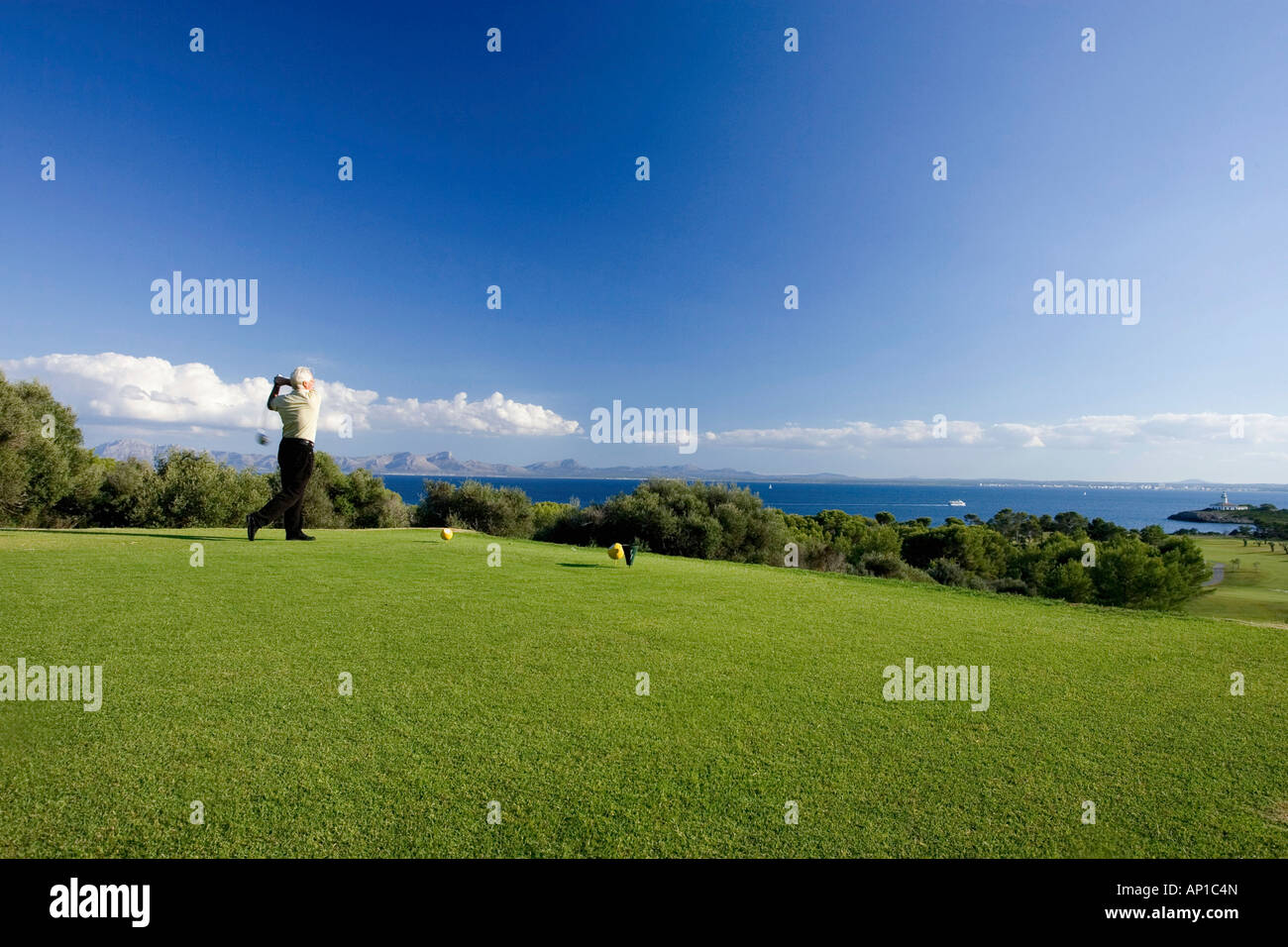 Senior man playing golf, Club de Golf Alcanada, Badia de Alcudia ...