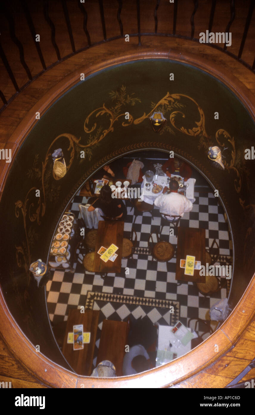 looking down fom the balcony of a baroque cafe interior with diners in ...