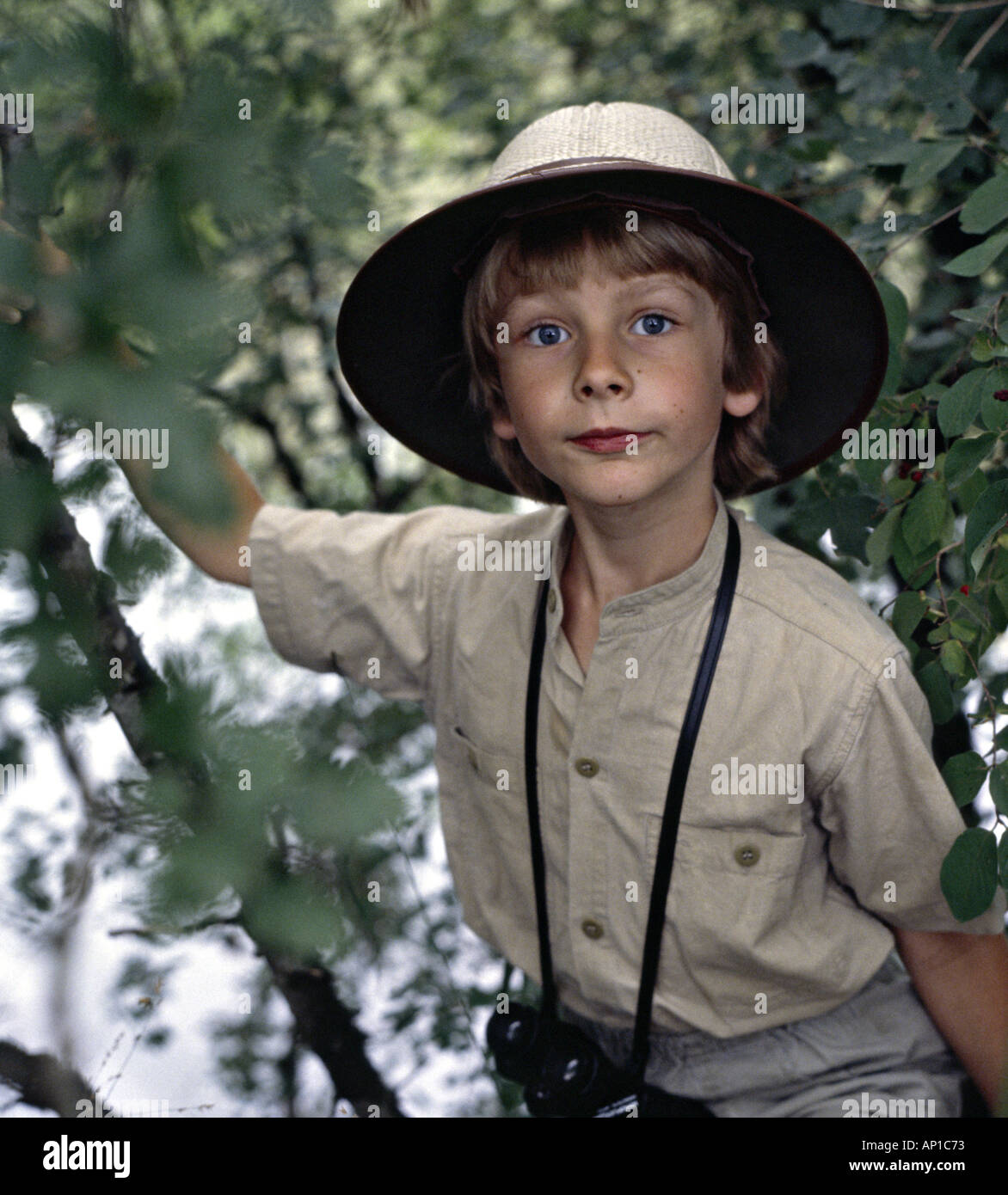 playing adventure boy playing jungle in forest Stock Photo - Alamy