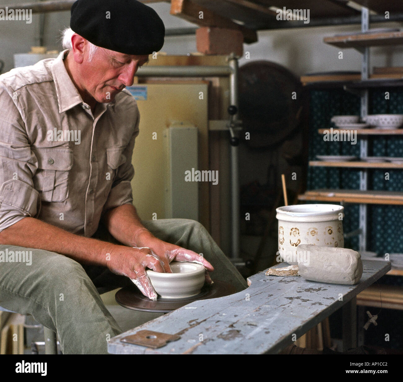 potter in his pottery making piece of pottery Stock Photo - Alamy
