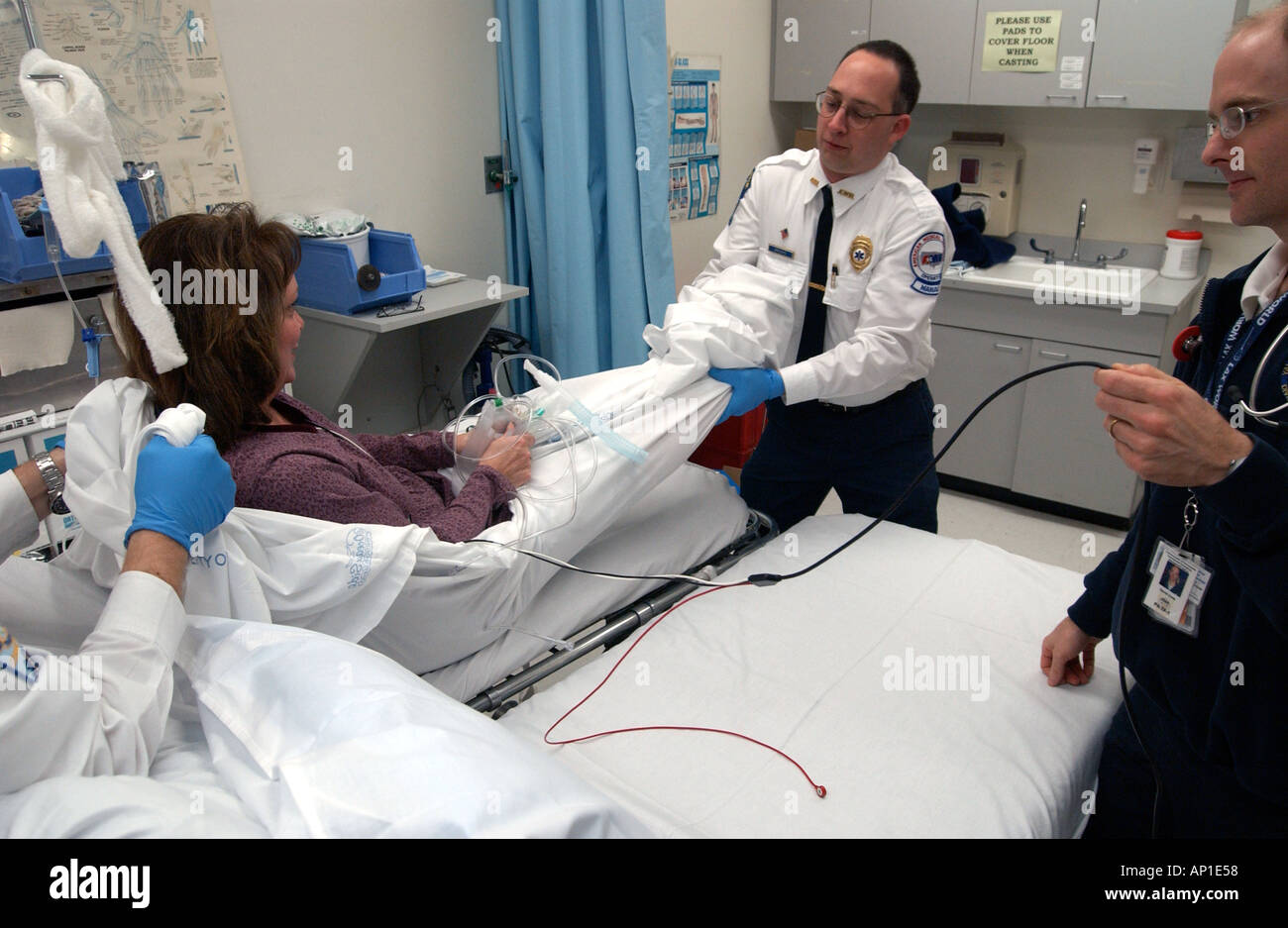 Medics transporting patient to hospital hi-res stock photography and ...