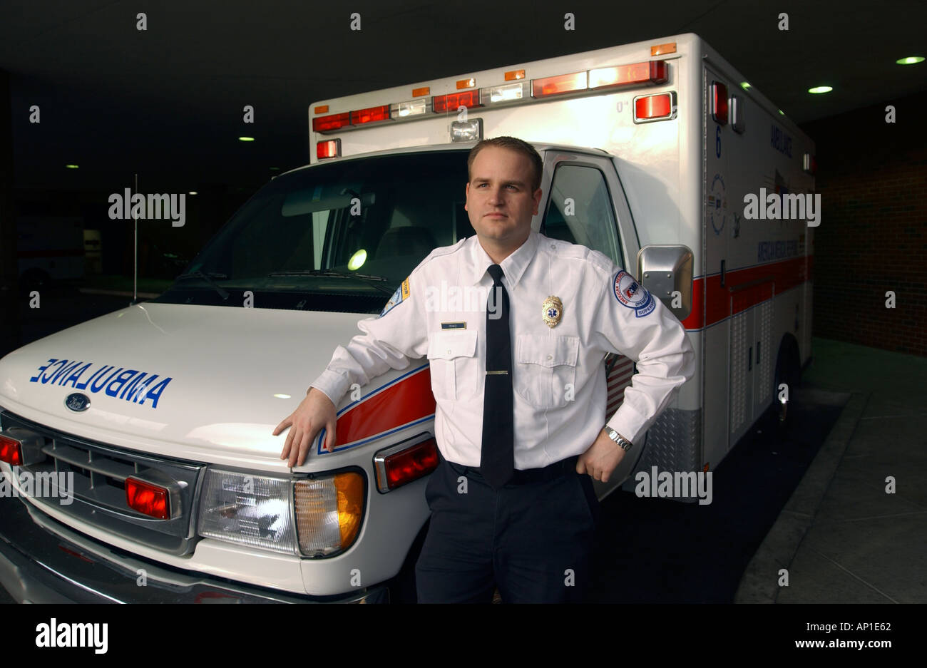 Paramedic EMS ambulance worker with emergency unit Stock Photo - Alamy