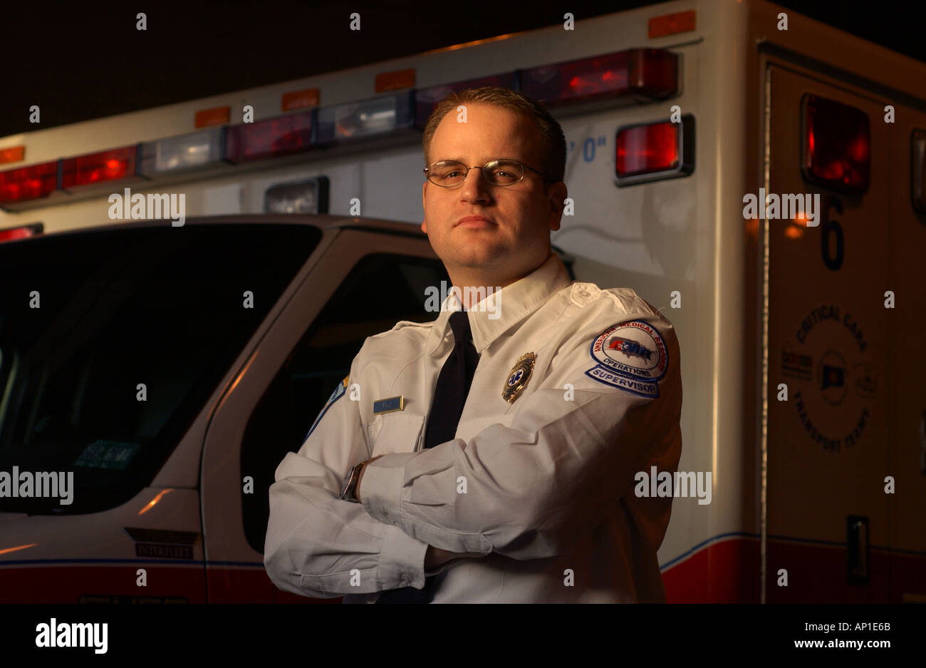 Paramedic EMS ambulance worker with emergency unit Stock Photo - Alamy