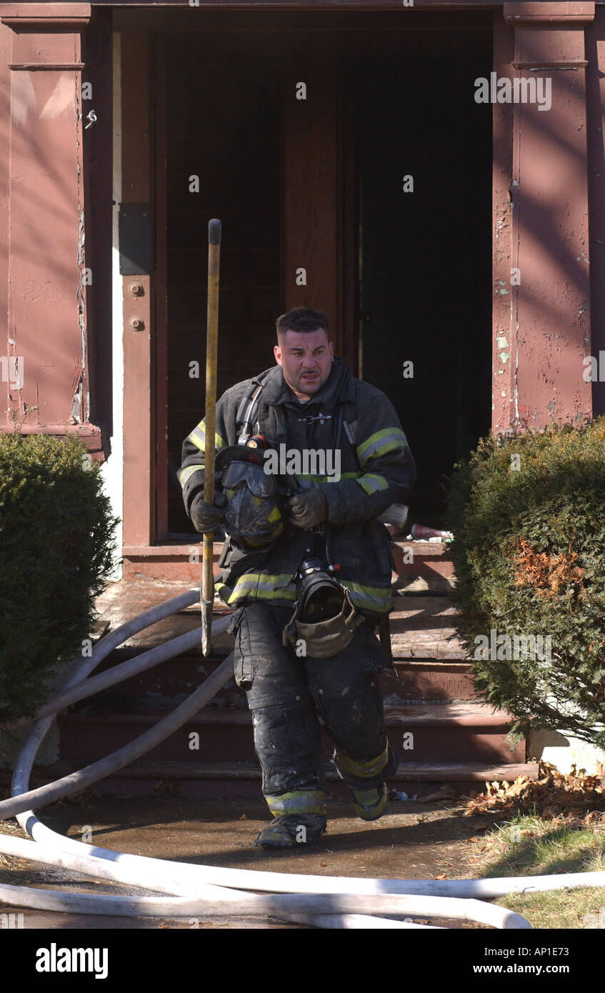 Firefighters fighting a fire House fire Stock Photo - Alamy